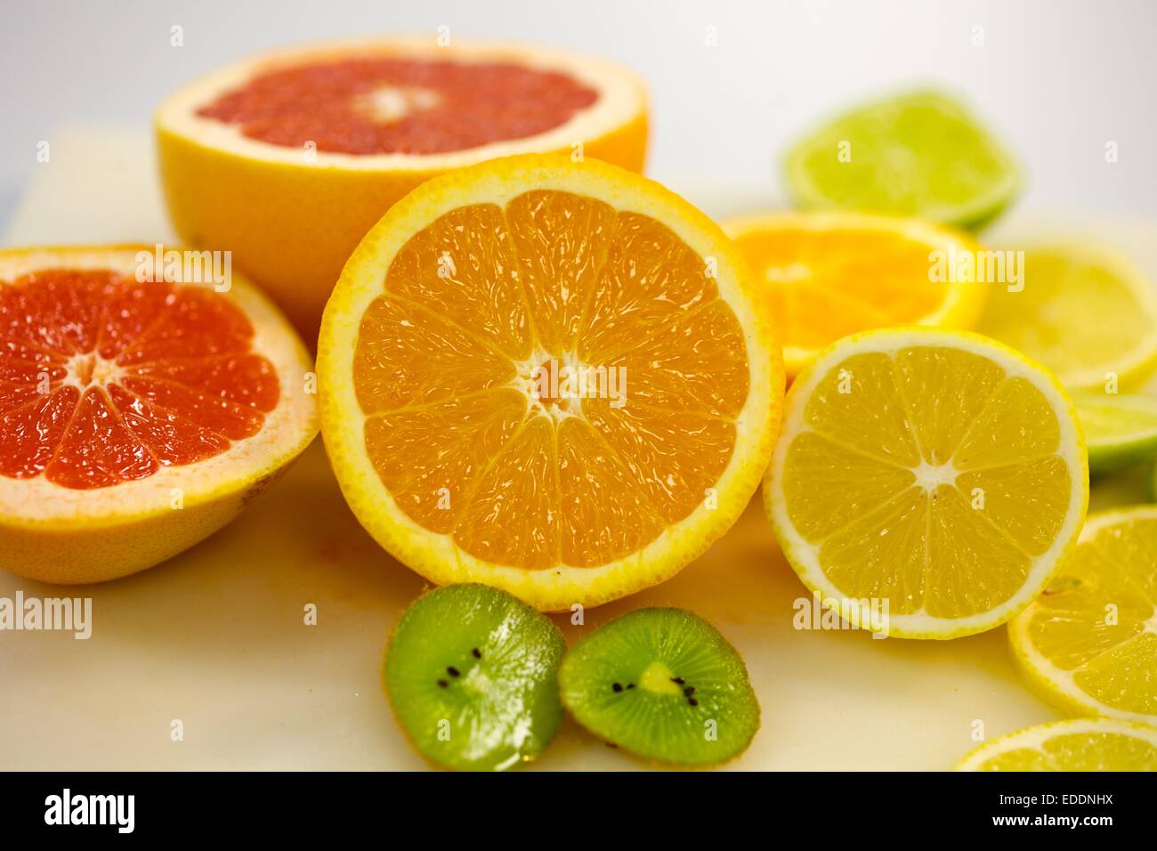slices of fruit on a chopping board Stock Photo - Alamy