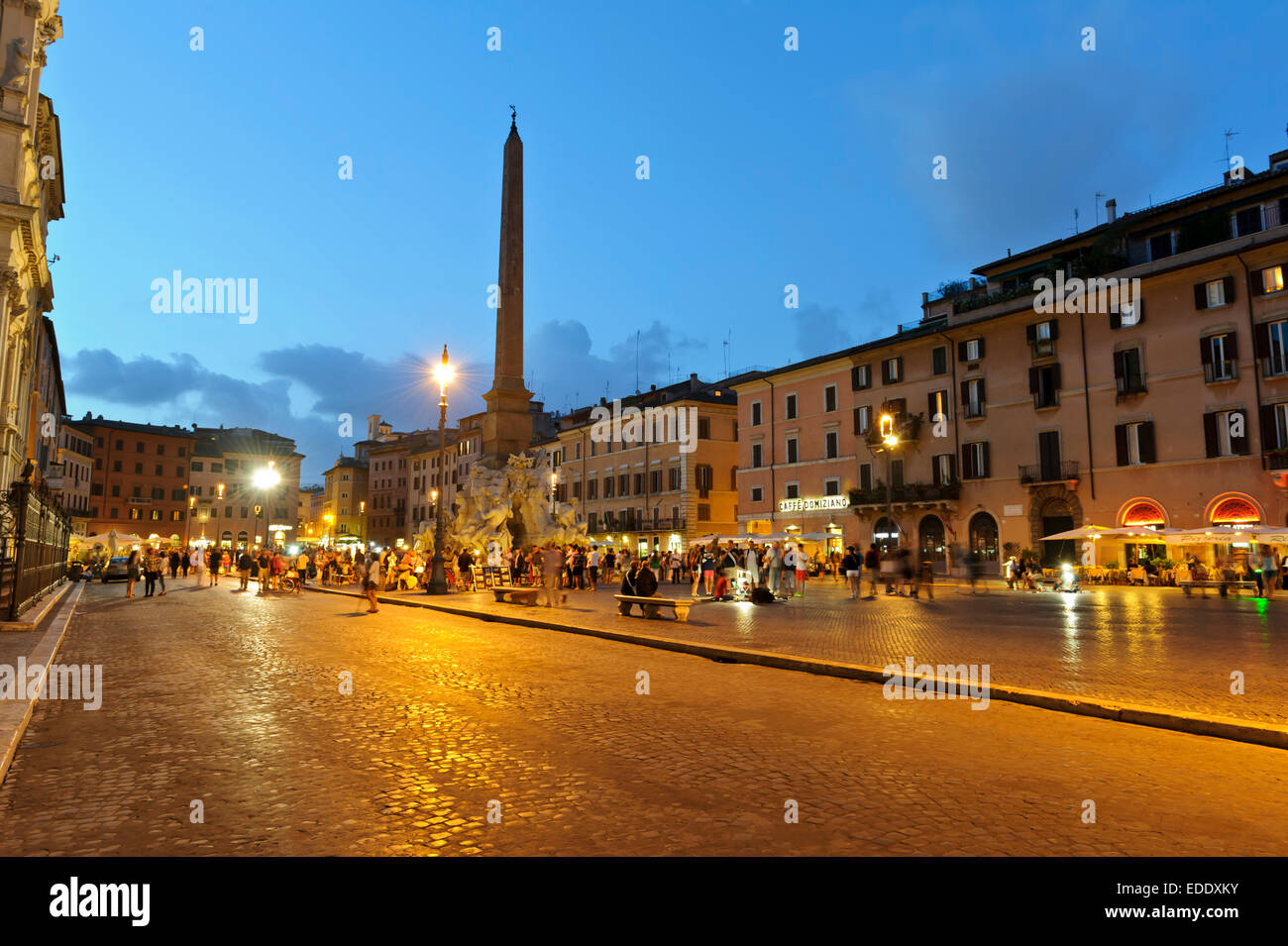 An obelisk in the four rivers water fountain in Piazza Novana by dusk ...