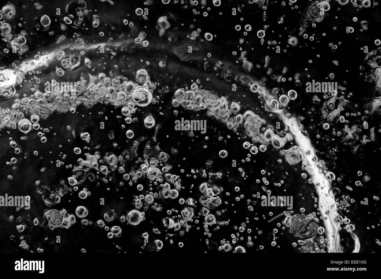 Lines of bubbles trapped in ice Stock Photo - Alamy