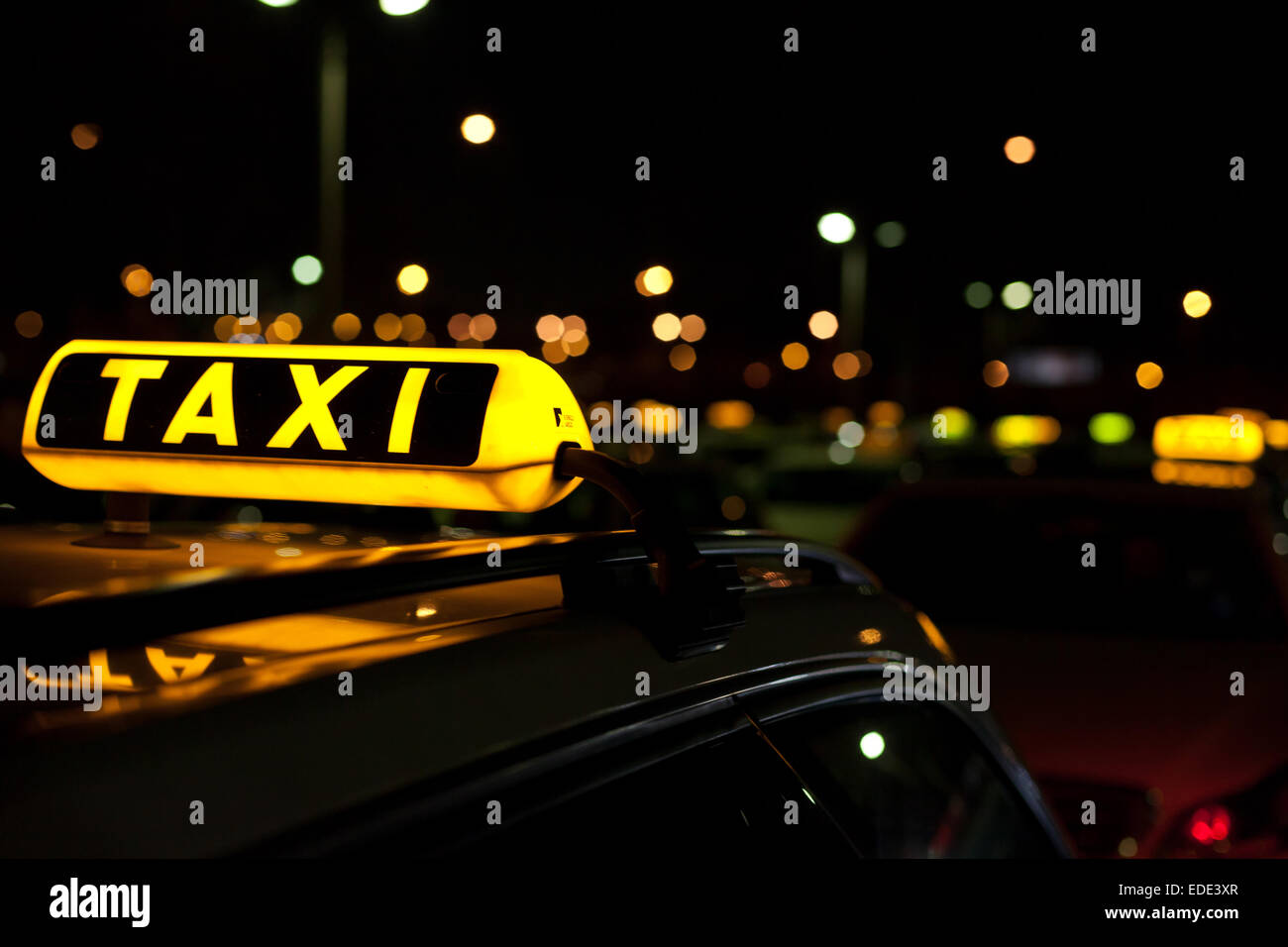 Taxi signs at night; nightshot of standing german cabs and their ...