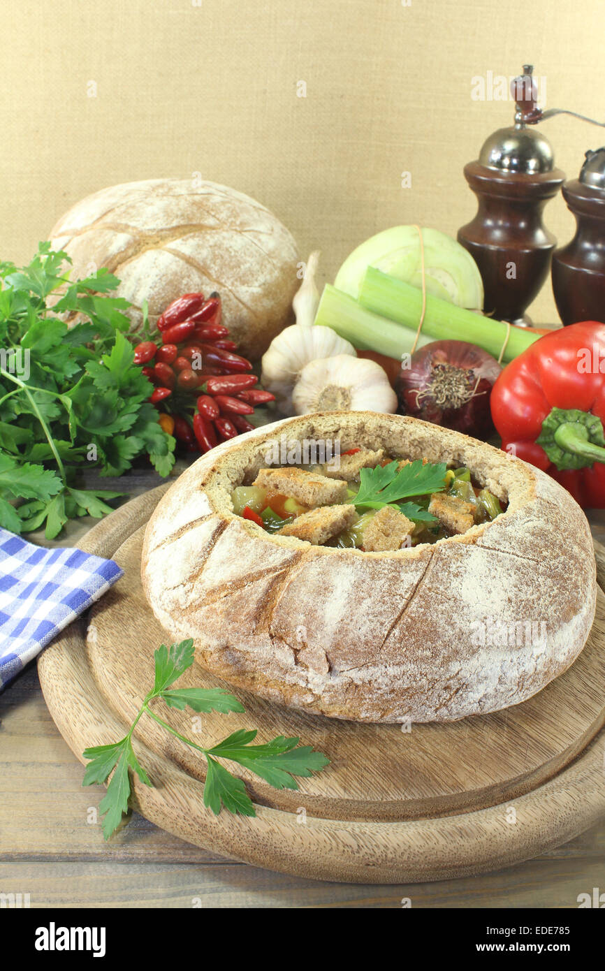 a loaf of bread filled with hearty bread soup Stock Photo - Alamy