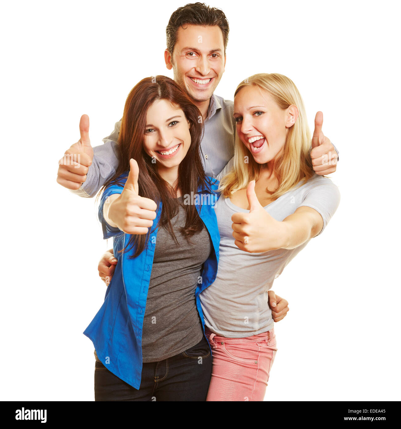 Three happy young people cheering and holding their thumbs up Stock ...