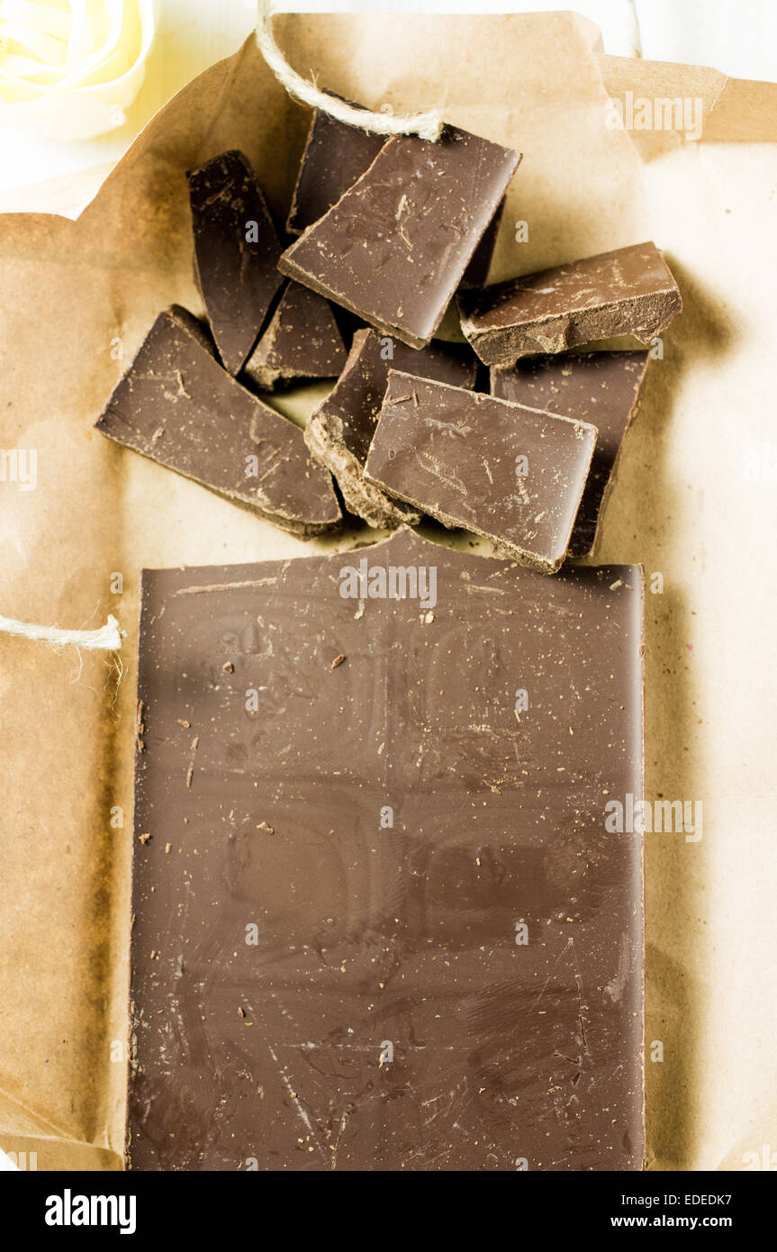 Chocolate bar in an open box with pieces Stock Photo - Alamy