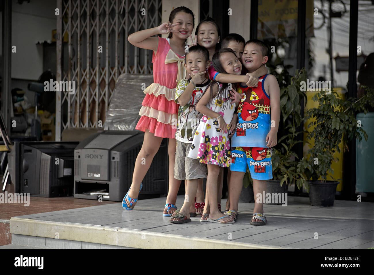 Thailand children. Group of happy and smiling Asian kids posing for a ...