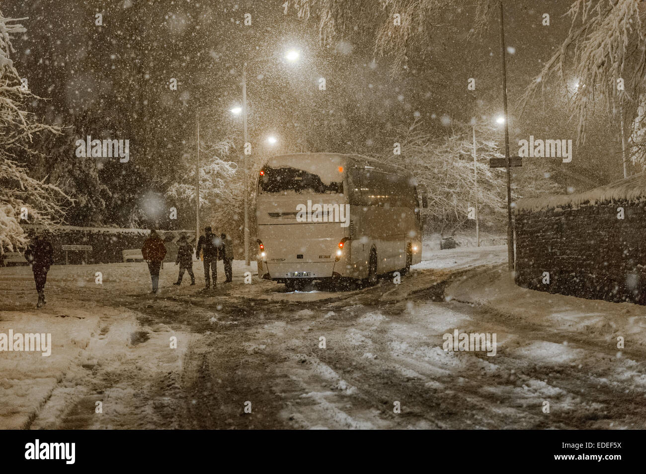 A stranded coach stuck on a hill during a snow storm in Mansfield ...