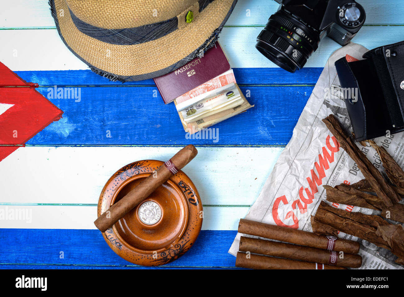 Cuban cigars on Cuba national flag with touristic accessories and ...
