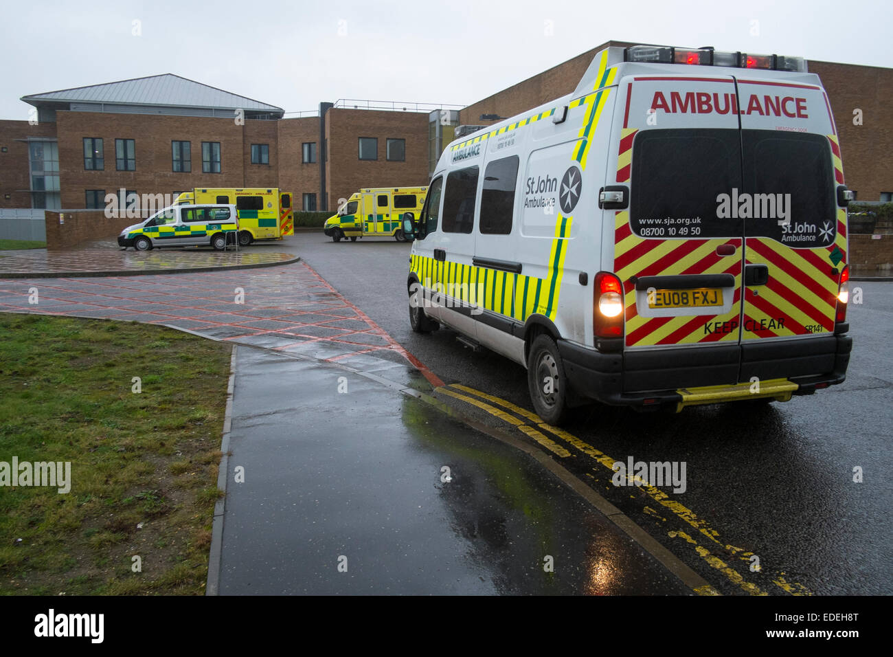 Norwich, UK. 6th January, 2015. Ambulances queue at Norfolk and Norwich ...