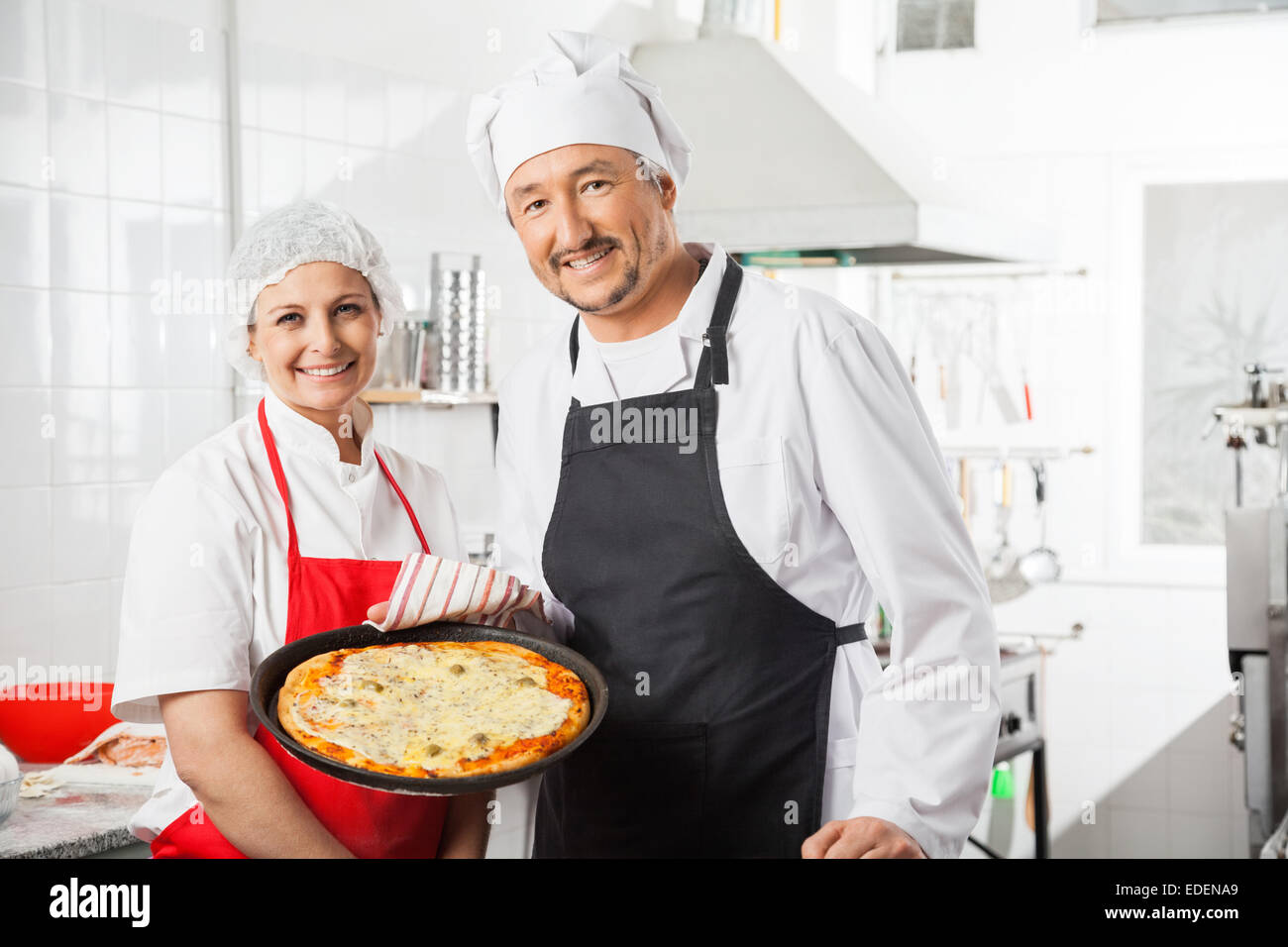 Portrait female pizza chef hi-res stock photography and images - Alamy