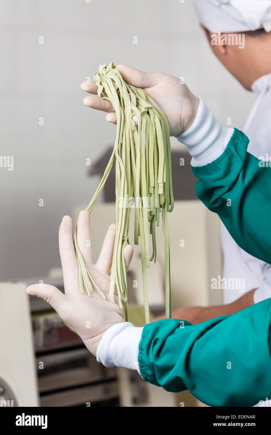 Chef Holding Spaghetti Pasta At Kitchen Stock Photo - Alamy