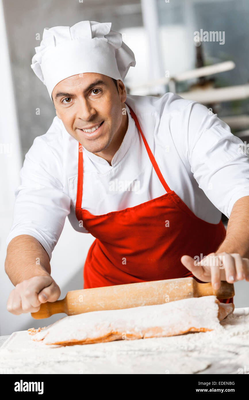 Handsome Chef Rolling Pasta Sheet At Counter Stock Photo - Alamy