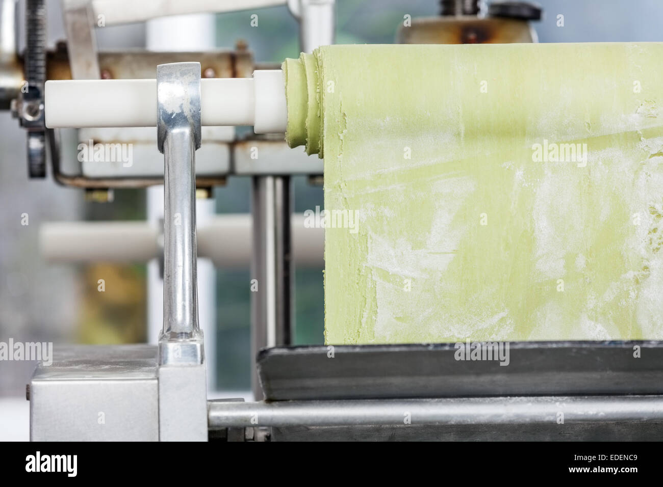 Green Spaghetti Pasta Sheet In Machine Stock Photo - Alamy