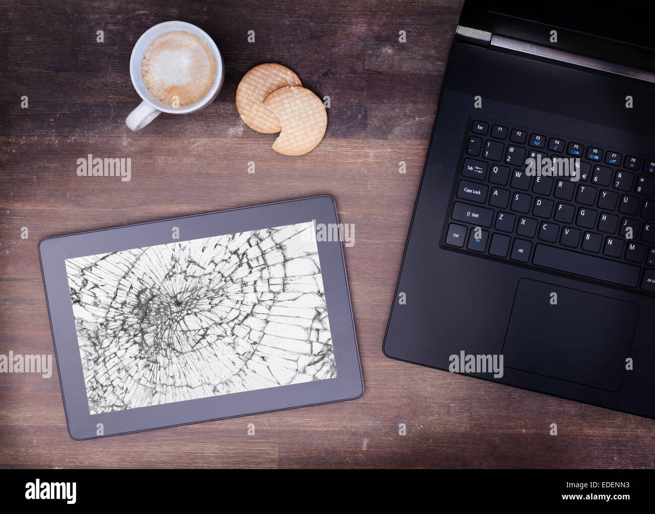 Tablet computer with broken glass, screen destroyed Stock Photo - Alamy