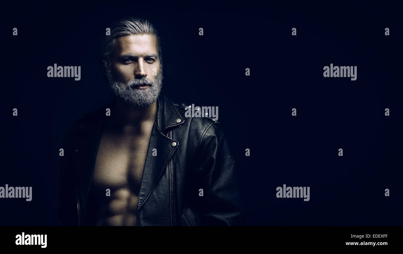 Artistic portrait of gray haired man on black background Stock Photo ...