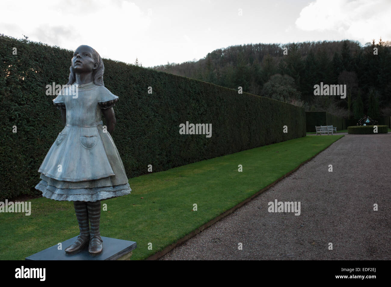 Statue of Alice in Wonderland in garden Stock Photo - Alamy