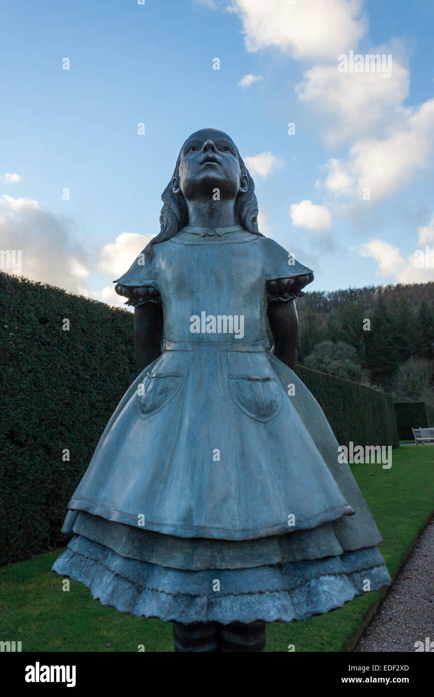Statue of Alice in Wonderland in garden Stock Photo - Alamy
