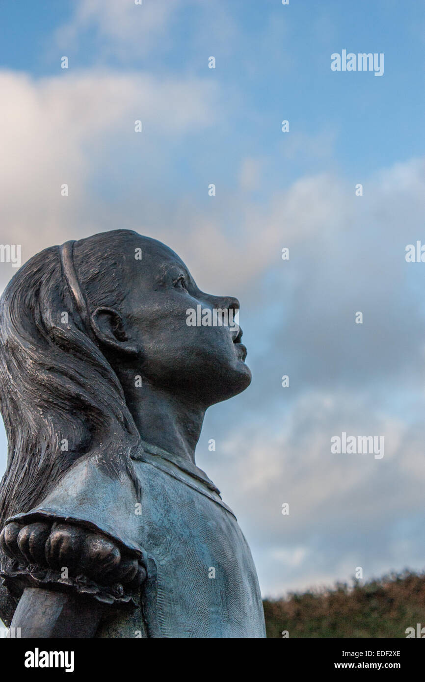 Statue of Alice in Wonderland in garden Stock Photo - Alamy