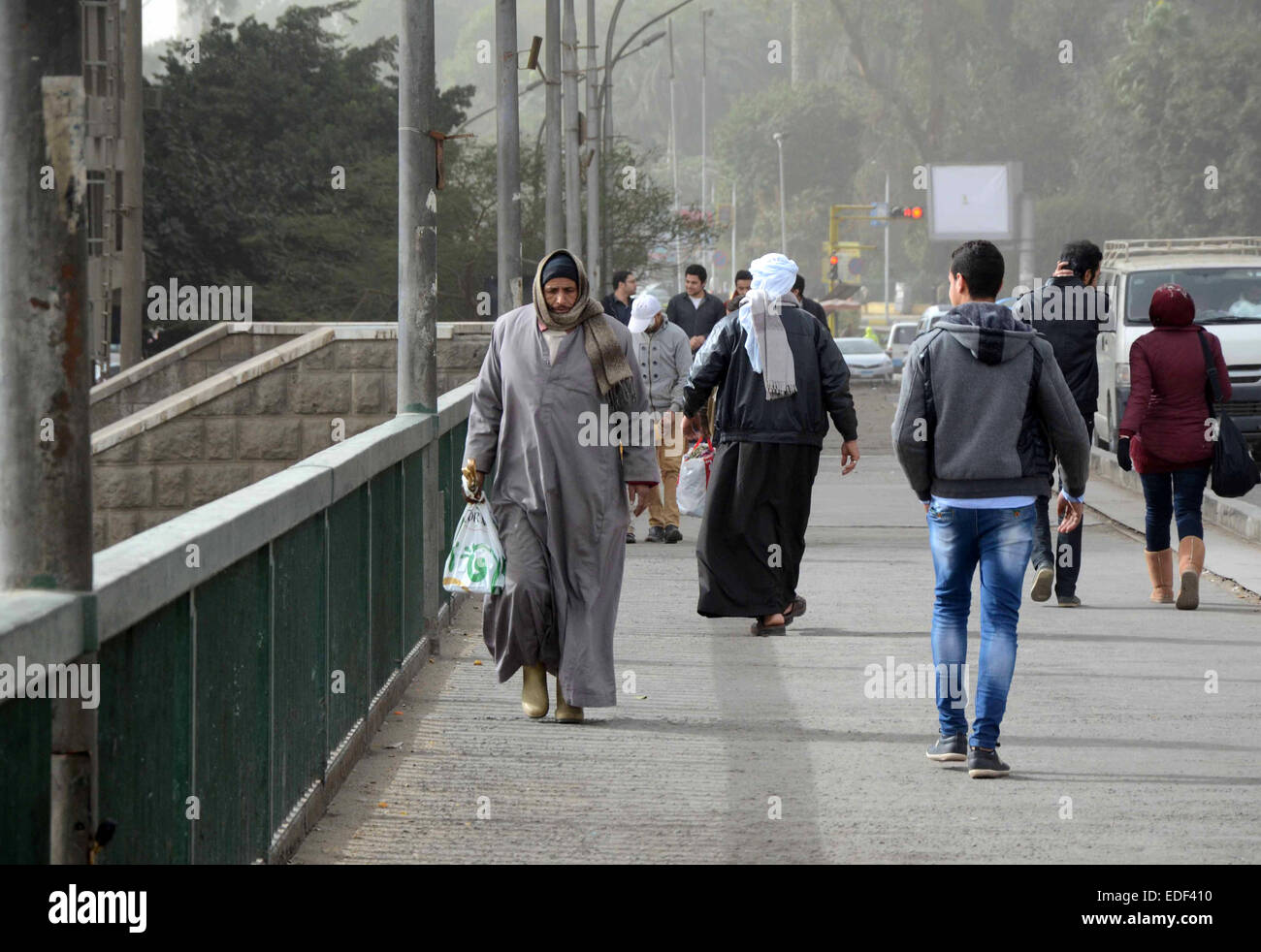 Cairo, Egypt. 5th Jan, 2015. Egyptians walk on the Qasr al-Nil bridge ...