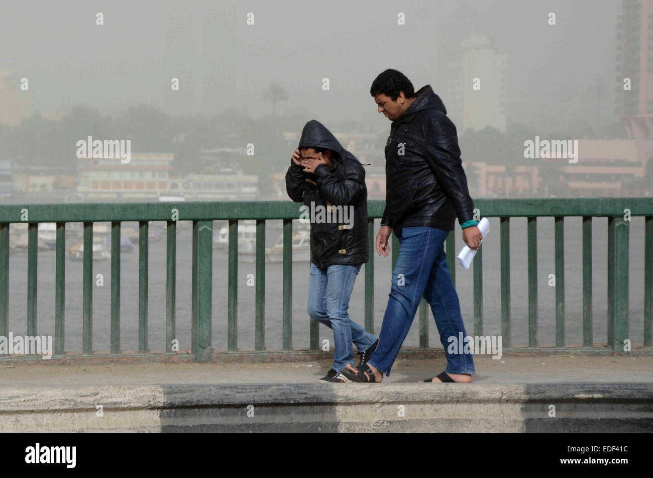 Cairo, Egypt. 5th Jan, 2015. Egyptians walk on the Qasr al-Nil bridge ...