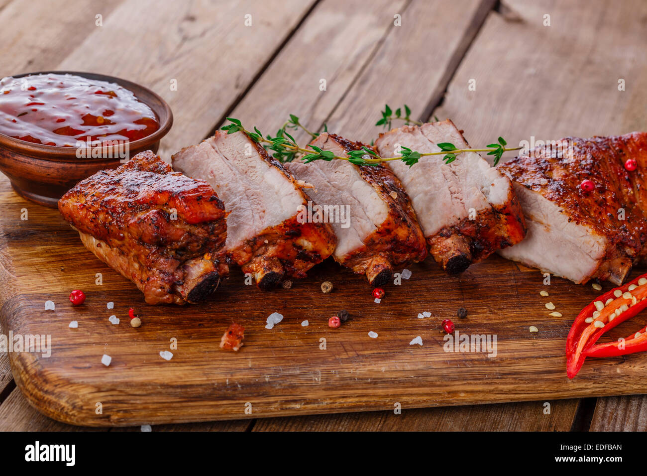 baked pork ribs on a wooden board Stock Photo - Alamy