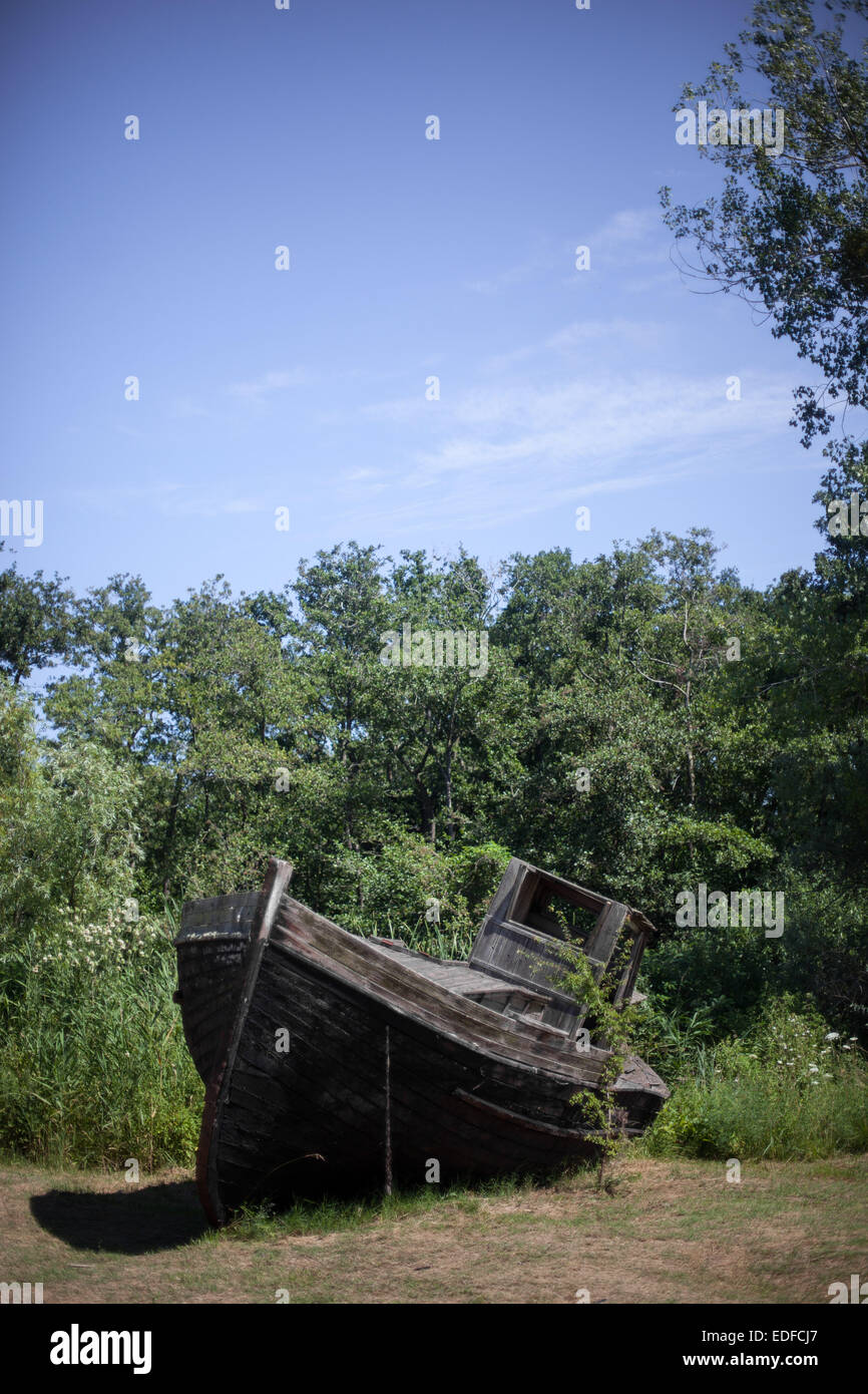 Color picture of a stranded wooden boat Stock Photo - Alamy