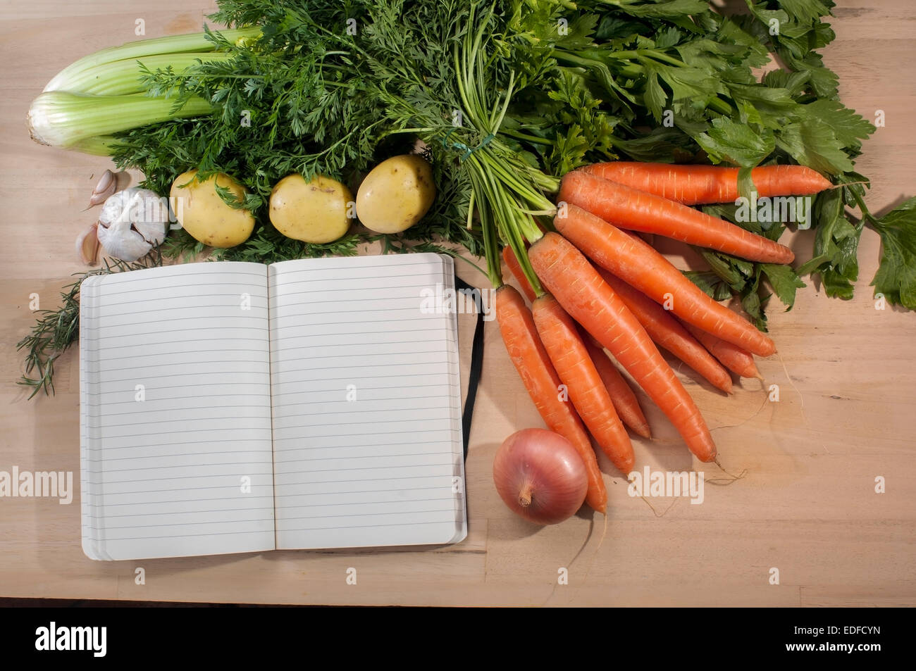 Recipe block note template on wooden cutting board with vegetables ...