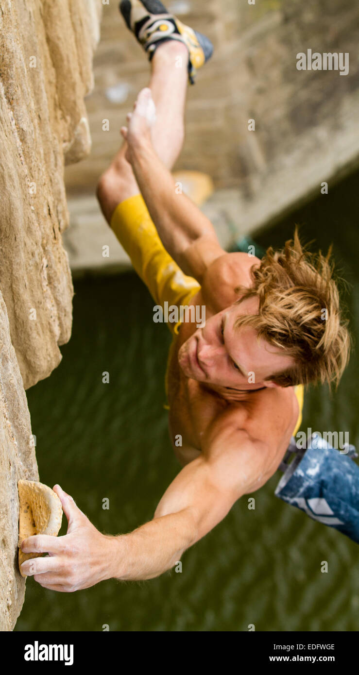 A man climbing a bridge Stock Photo - Alamy