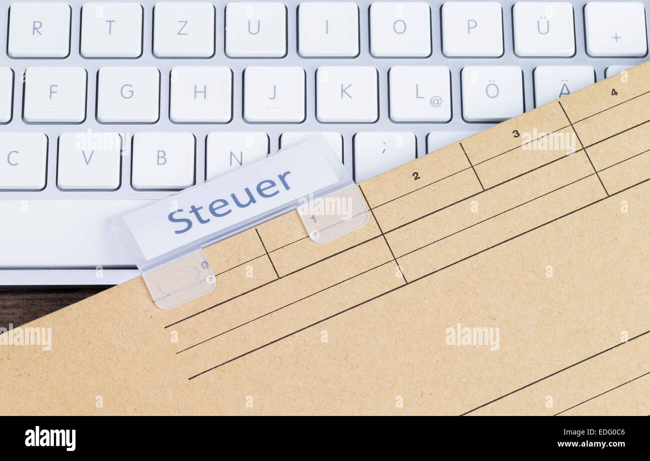 Image shows a white keyboard with a paper folder Stock Photo - Alamy