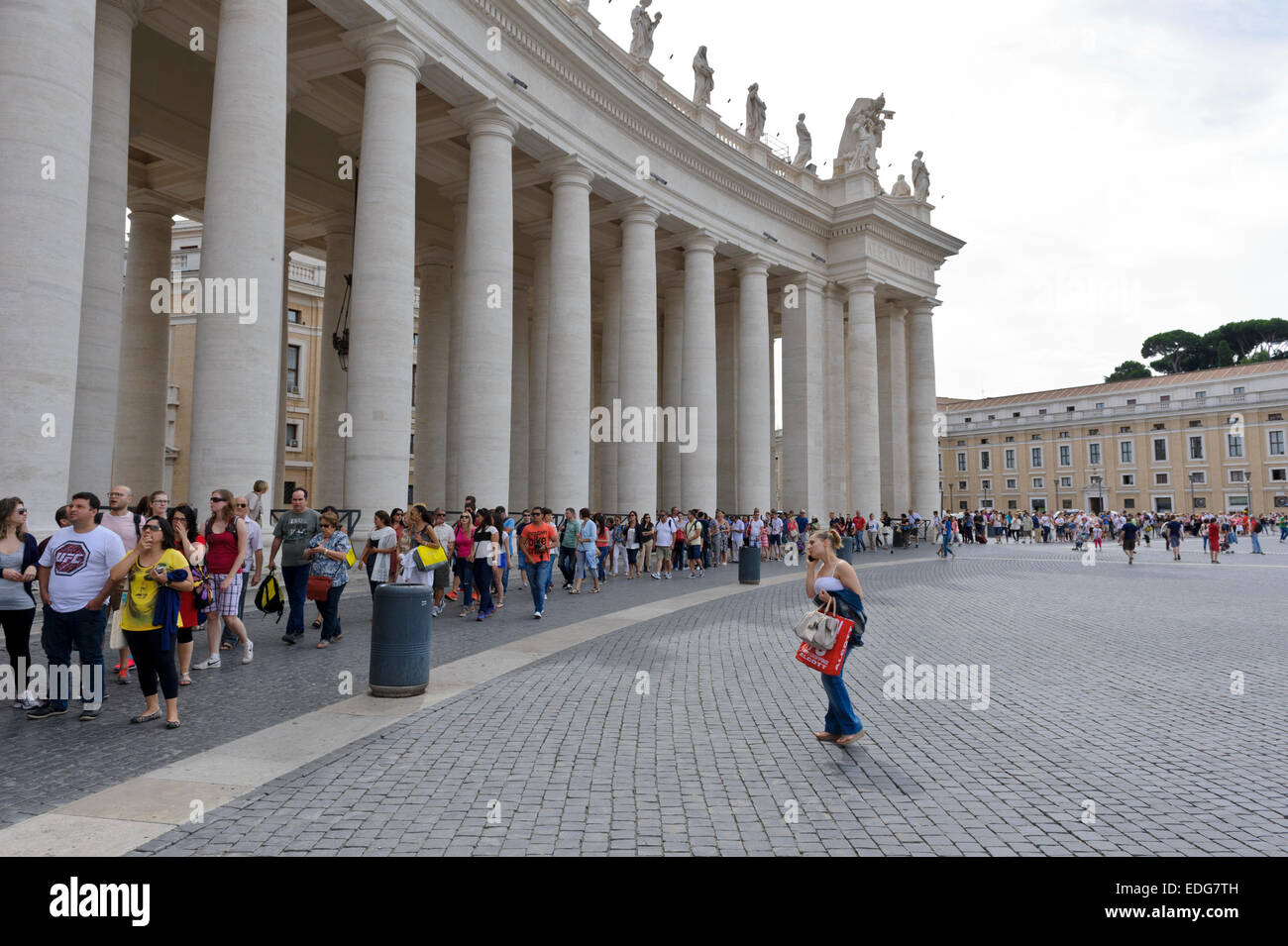 A long queue of tourists awaiting to enter St Peter Basilica in Vatican ...