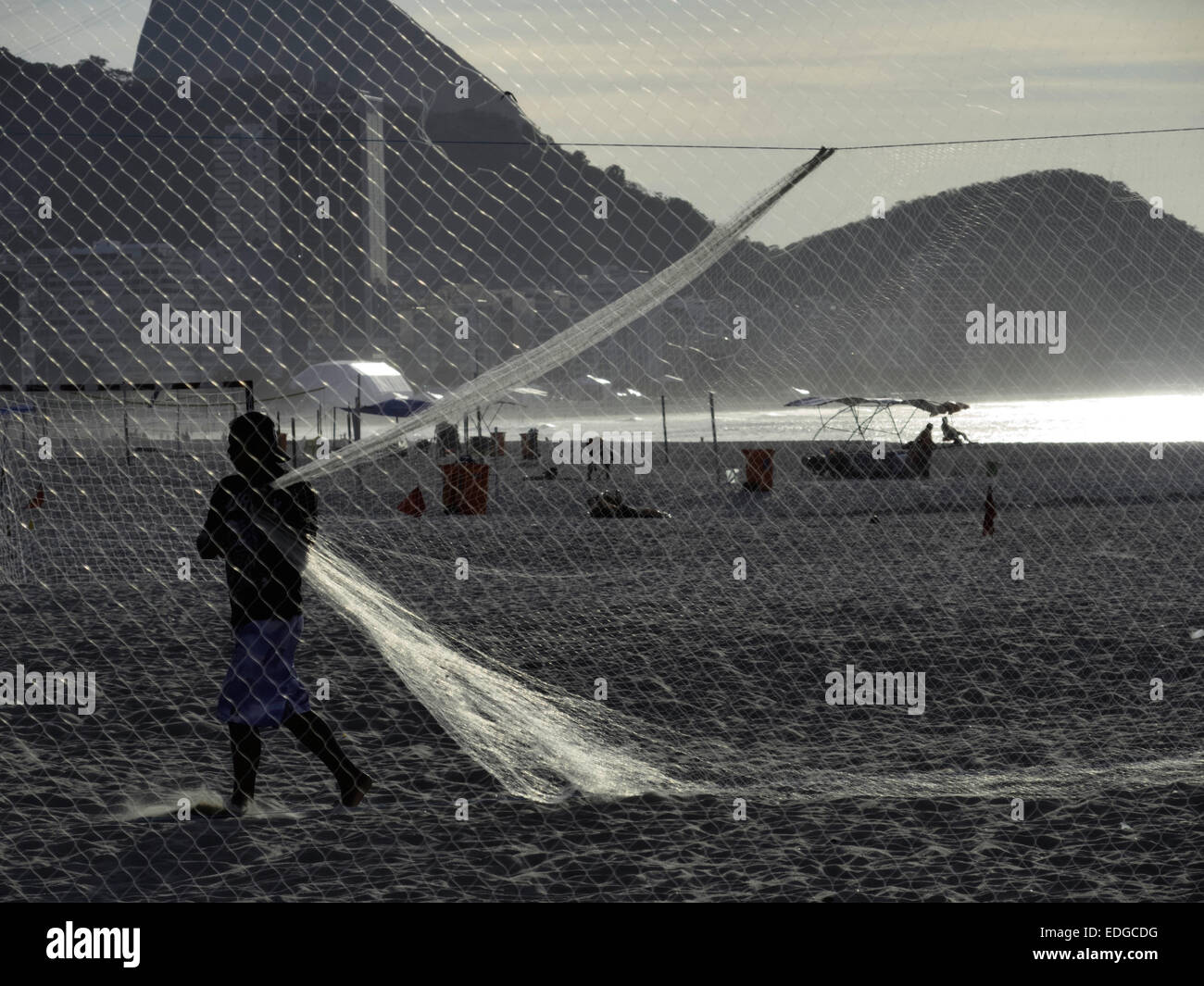 Man with net at beach, Copacabana, Rio De Janeiro, Brazil Stock Photo ...