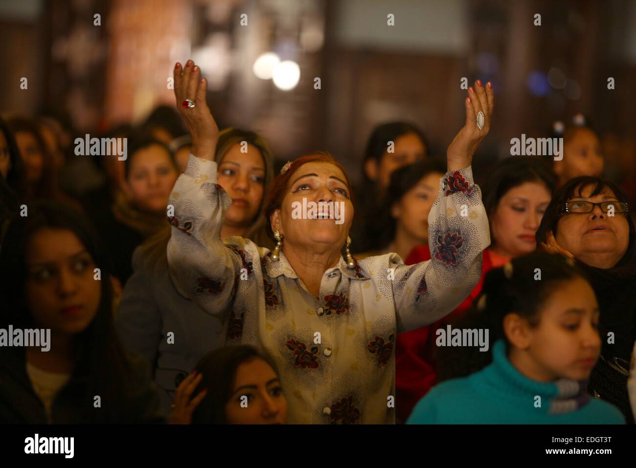 Cairo, Egypt. 6th Jan, 2015. A female copt prays during the Coptic ...
