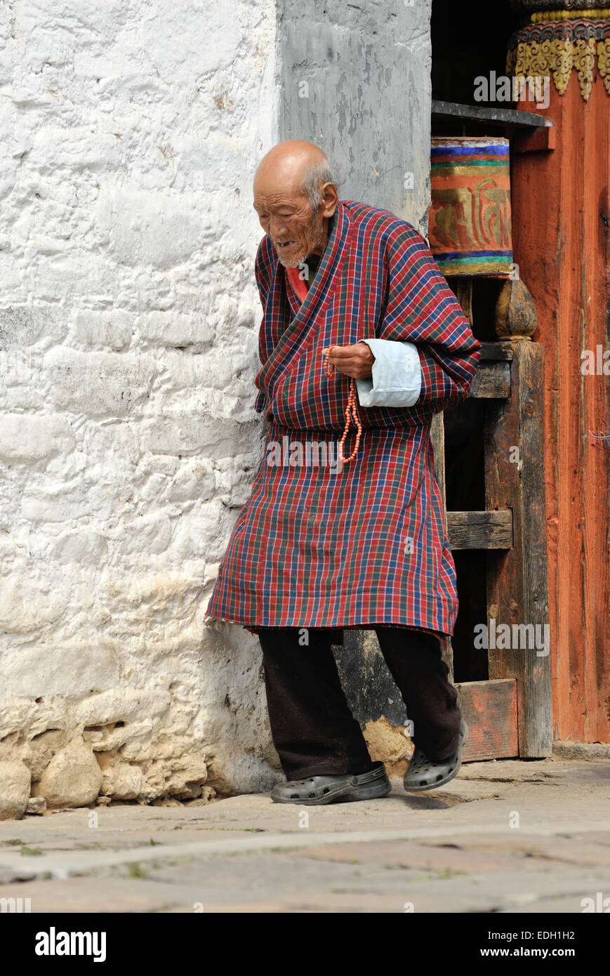 Man wearing traditional clothes in Jampey Lhakhang temple, Jakar ...