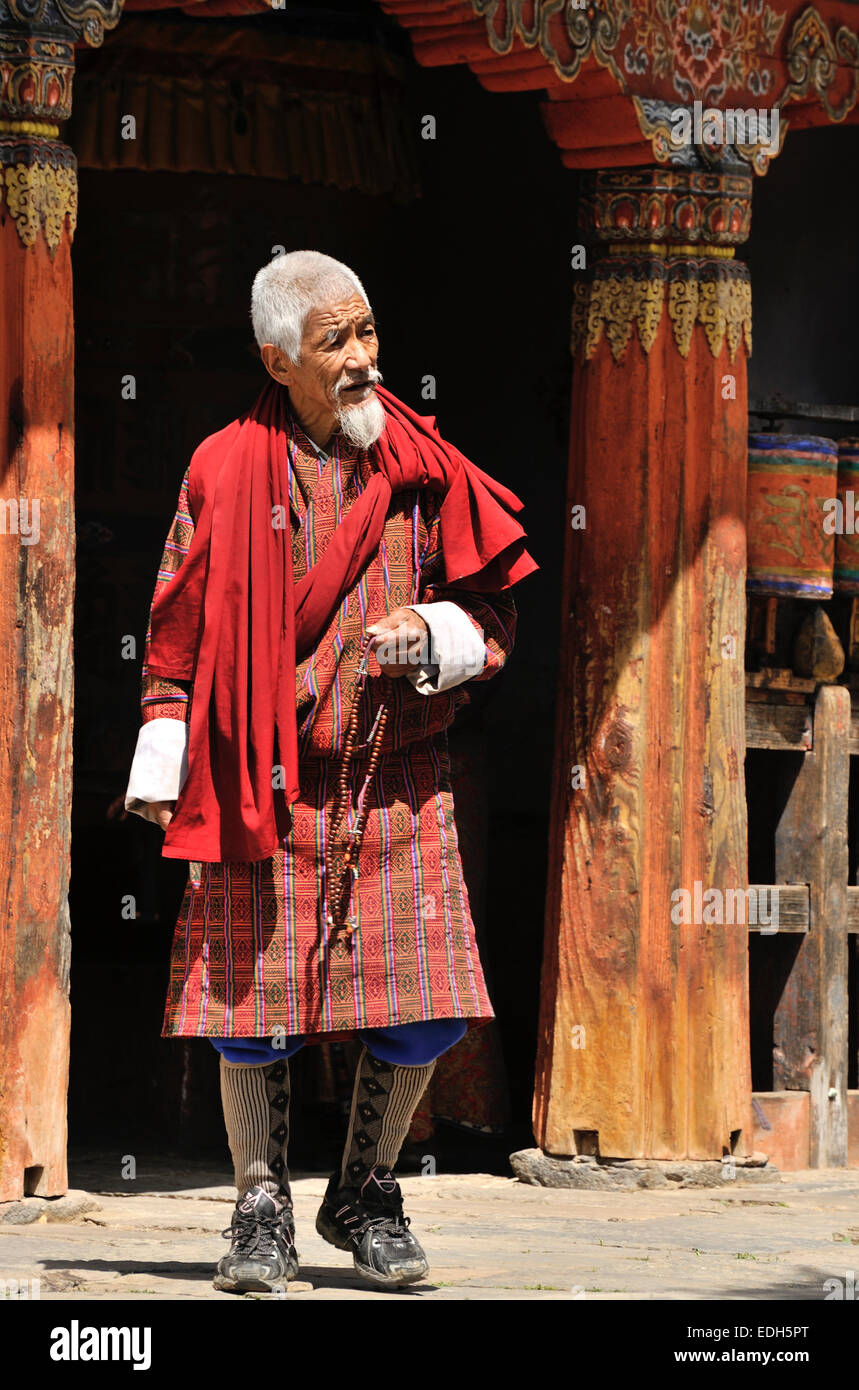 Man wearing traditional clothes in Jampey Lhakhang temple, Jakar ...