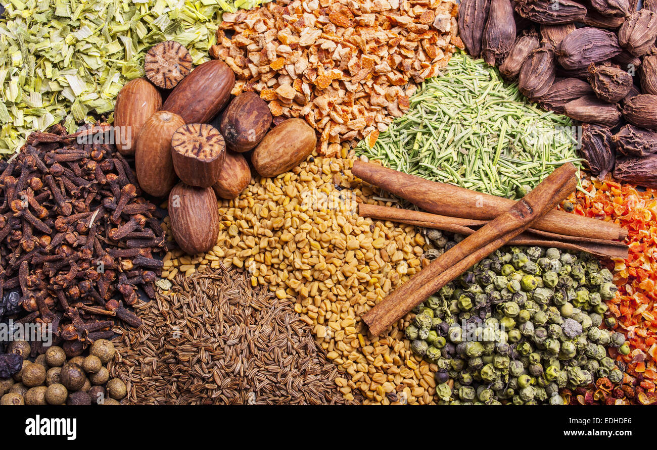 Colorful spices and herbs background Stock Photo - Alamy