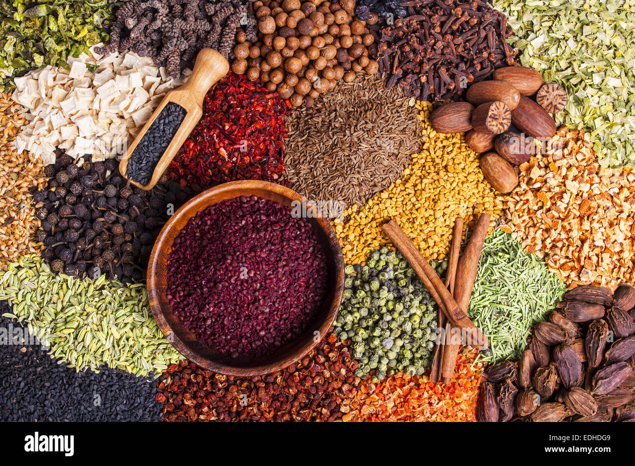 Colorful spices and herbs background Stock Photo - Alamy