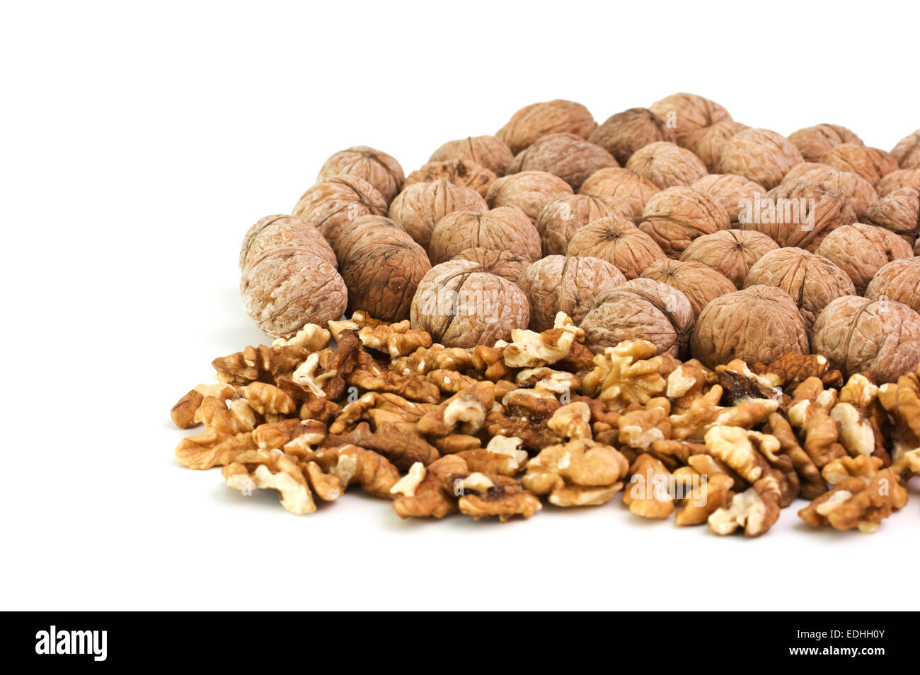 pile of walnuts isolated on a white background Stock Photo - Alamy