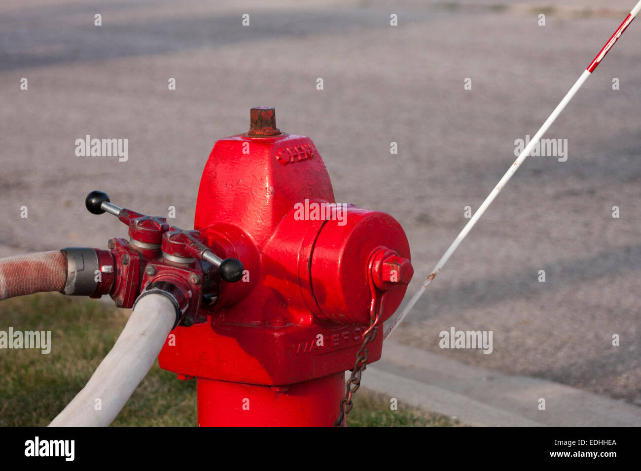 Red Hydrant and hoselines attached with valves Stock Photo - Alamy