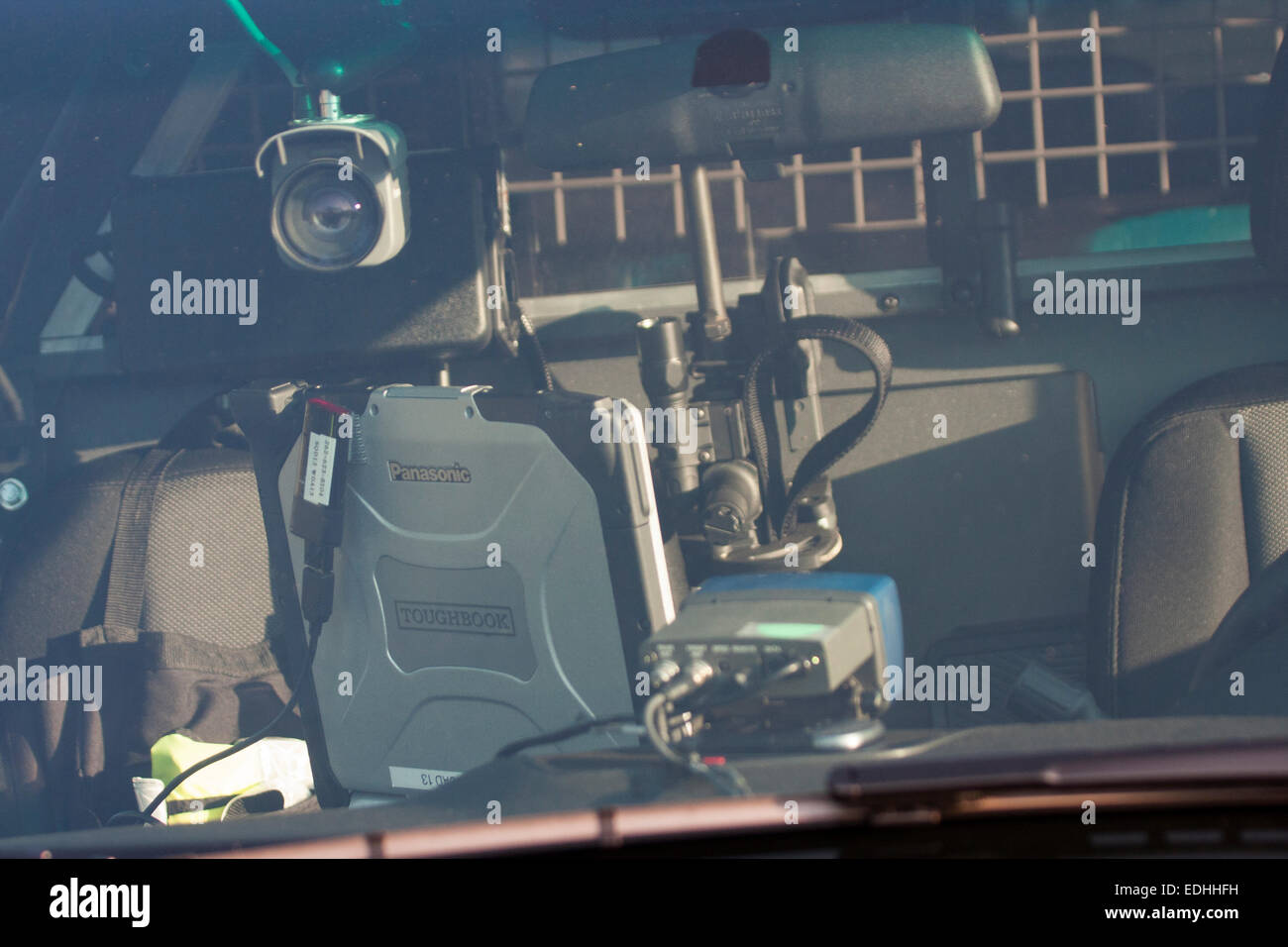 The inside of a squad police car showing a camera radar computer and ...