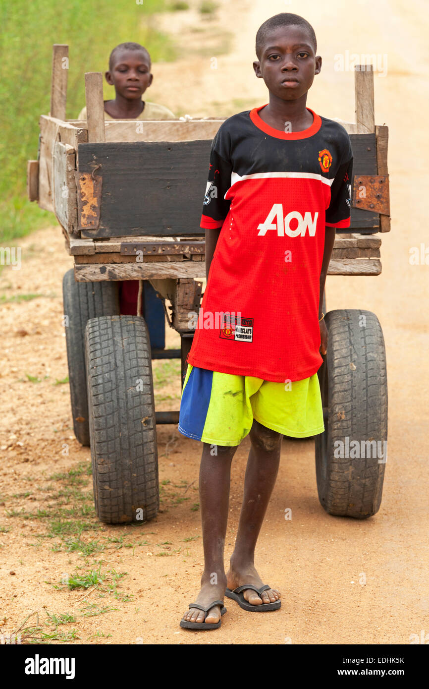 Children pulling cart on rural road, Greater Accra, Ghana, Africa Stock ...