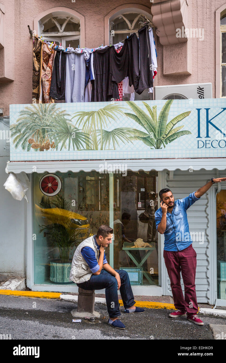 A street scene with shops and laundry drying on the balcony in Istanbul ...
