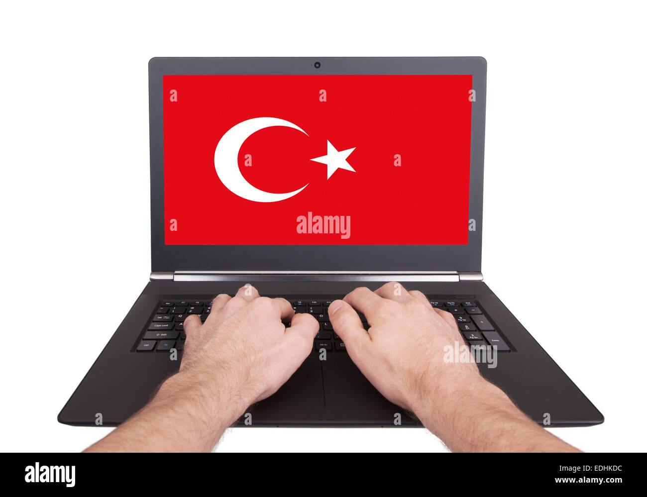 Hands working on laptop showing on the screen the flag of Turkey Stock ...