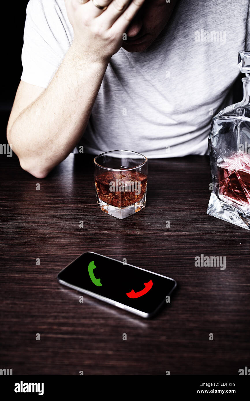 Drunk man in front of a mobile phone Stock Photo - Alamy