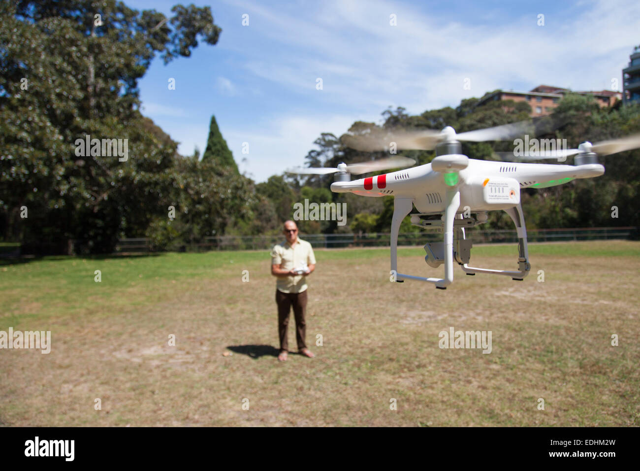 Drone Operator flying his drone Stock Photo - Alamy