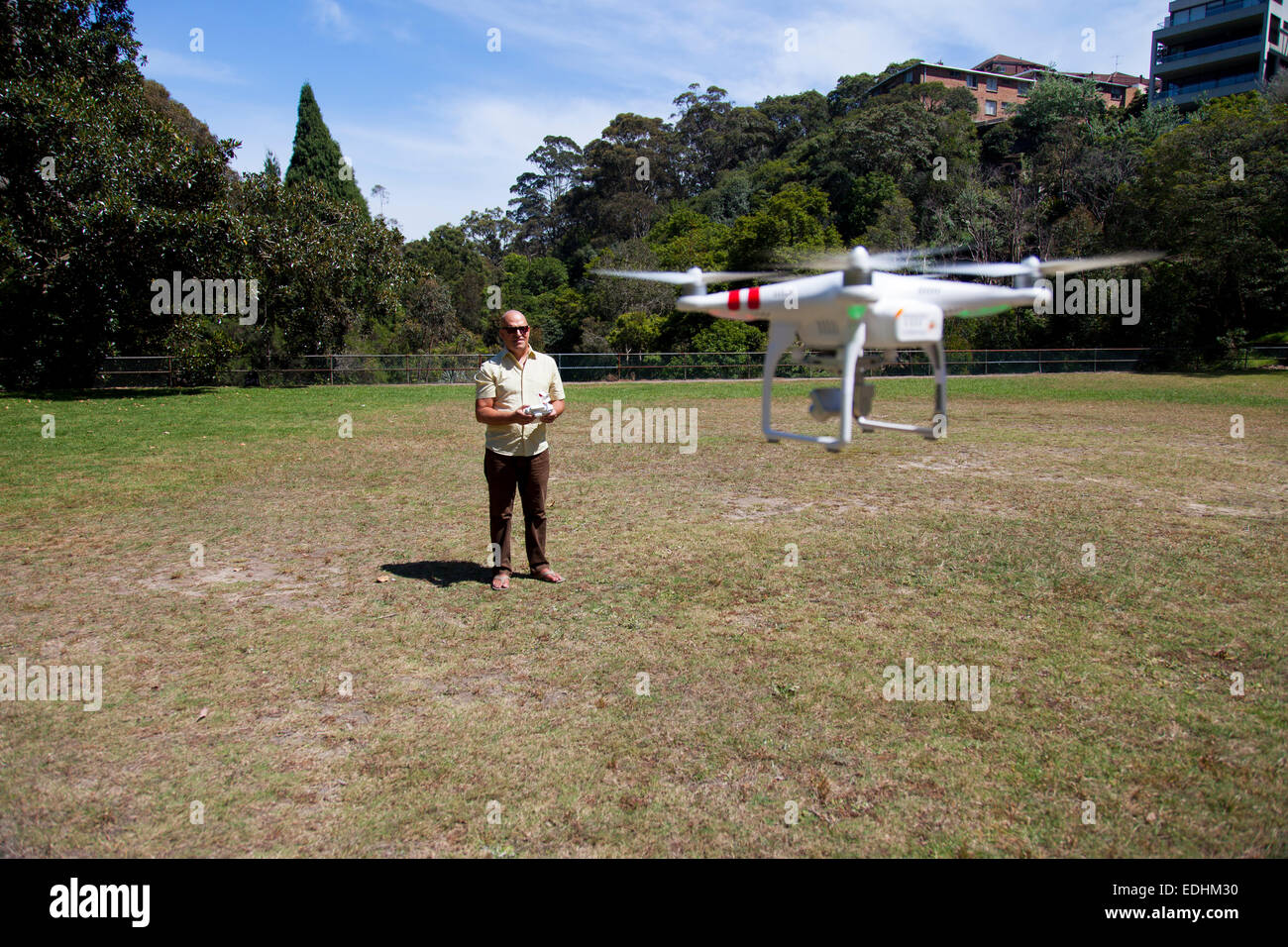 Drone Operator flying his drone Stock Photo - Alamy