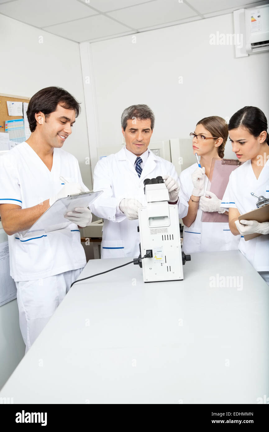 Scientist Analyzing Sample In Medical Laboratory Stock Photo - Alamy