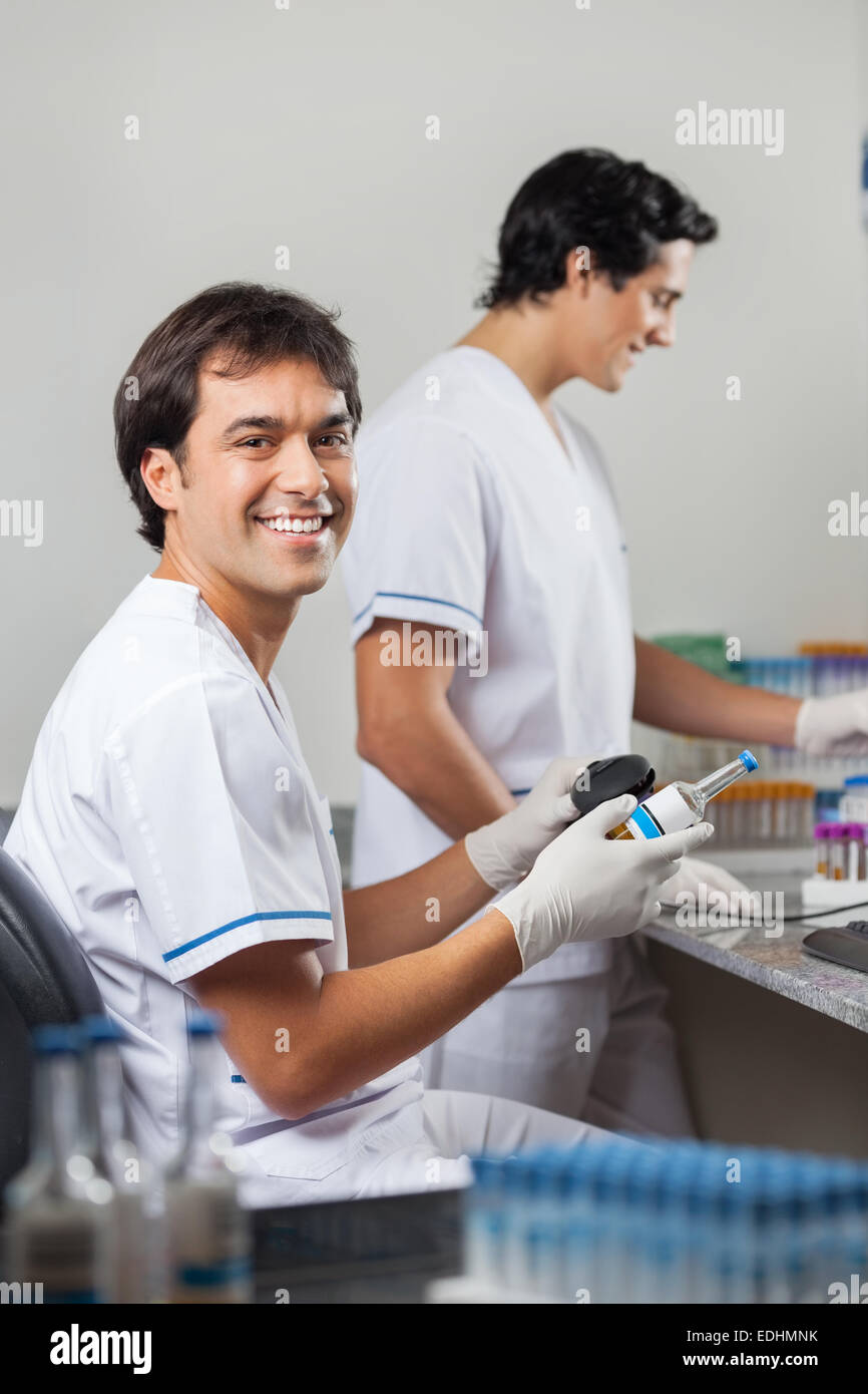 Technician Using Barcode Reader To Scan Sample In Lab Stock Photo - Alamy