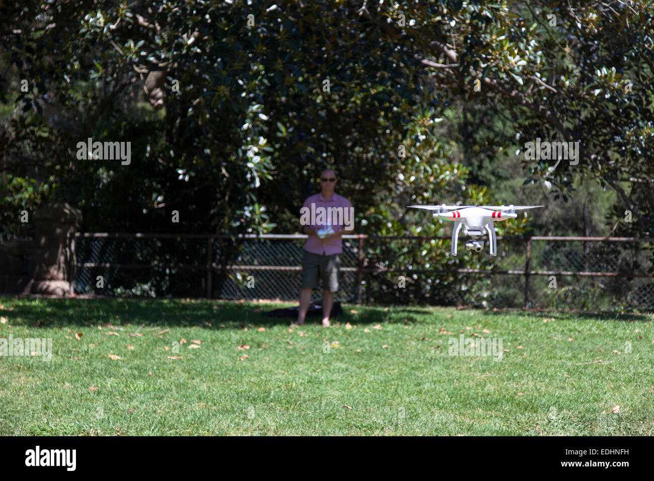 Drone Operator flying a drone with camera Stock Photo - Alamy