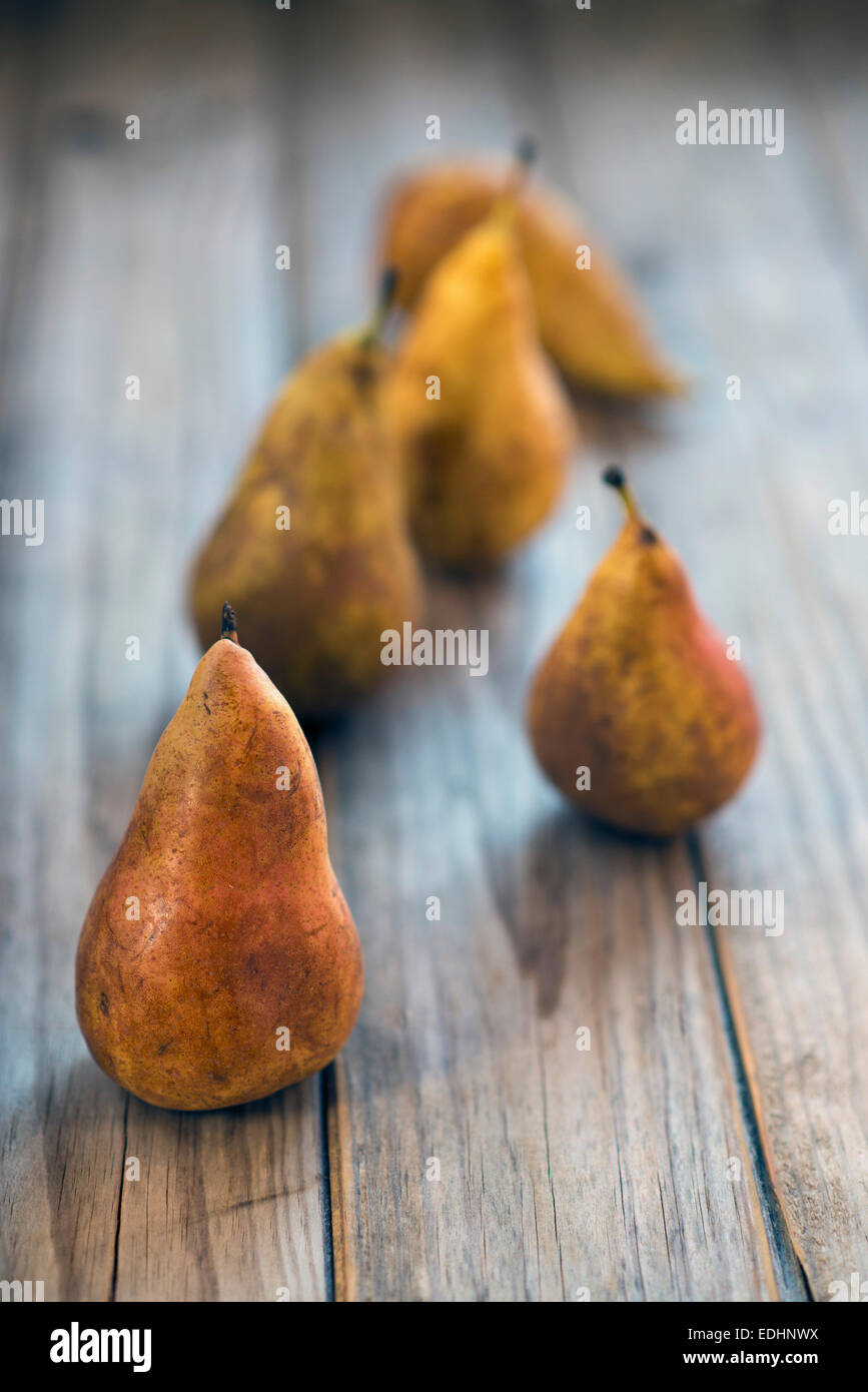 five pears on a wooden table Stock Photo - Alamy