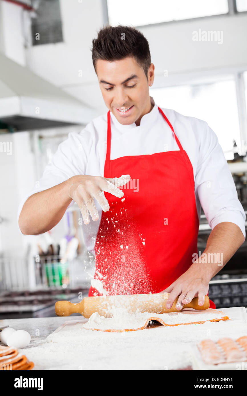 Chef Dusting Flour On Ravioli Pasta Sheet In Kitchen Stock Photo - Alamy