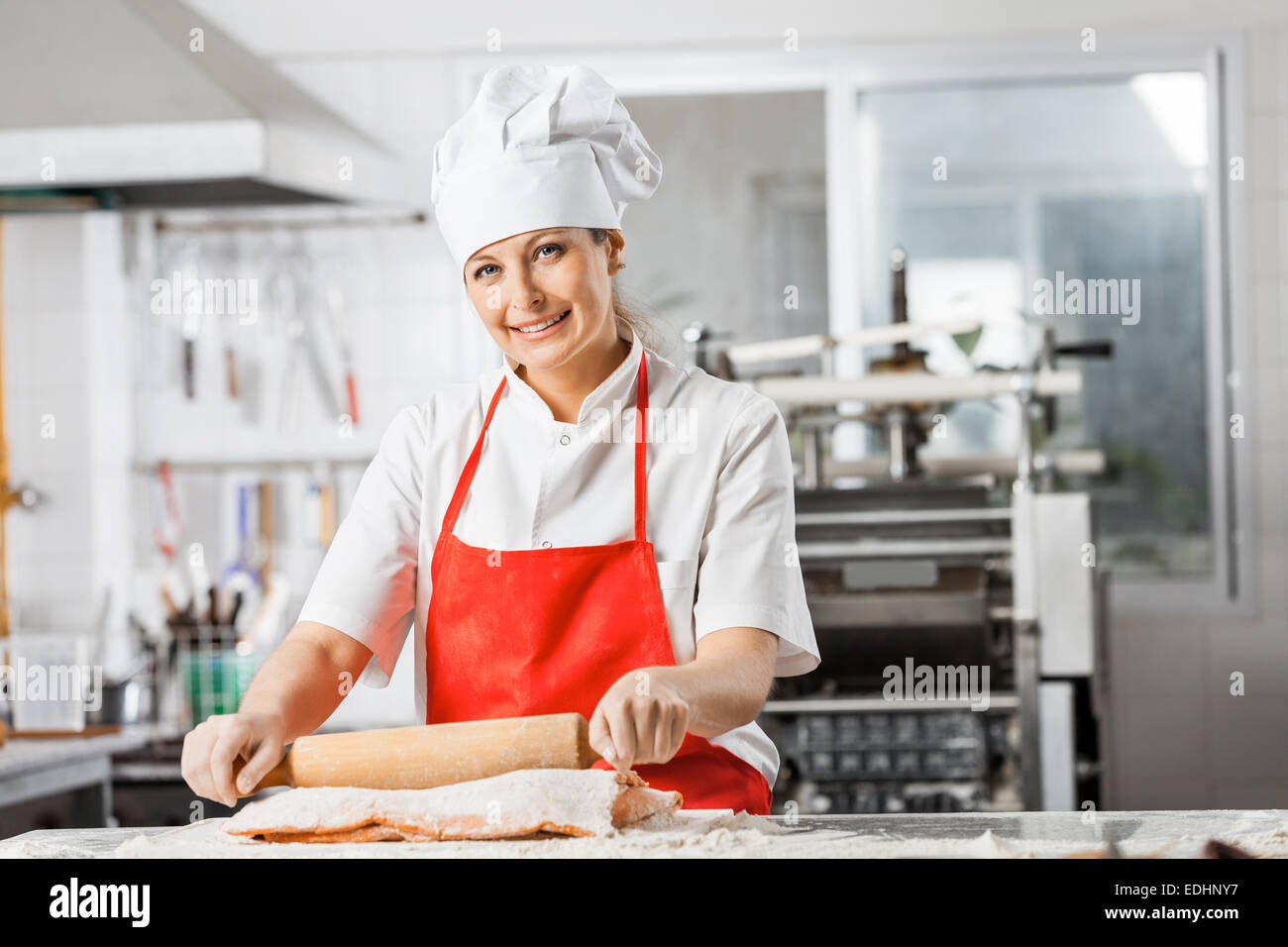 Happy Chef Rolling Pasta Sheet In Kitchen Stock Photo - Alamy