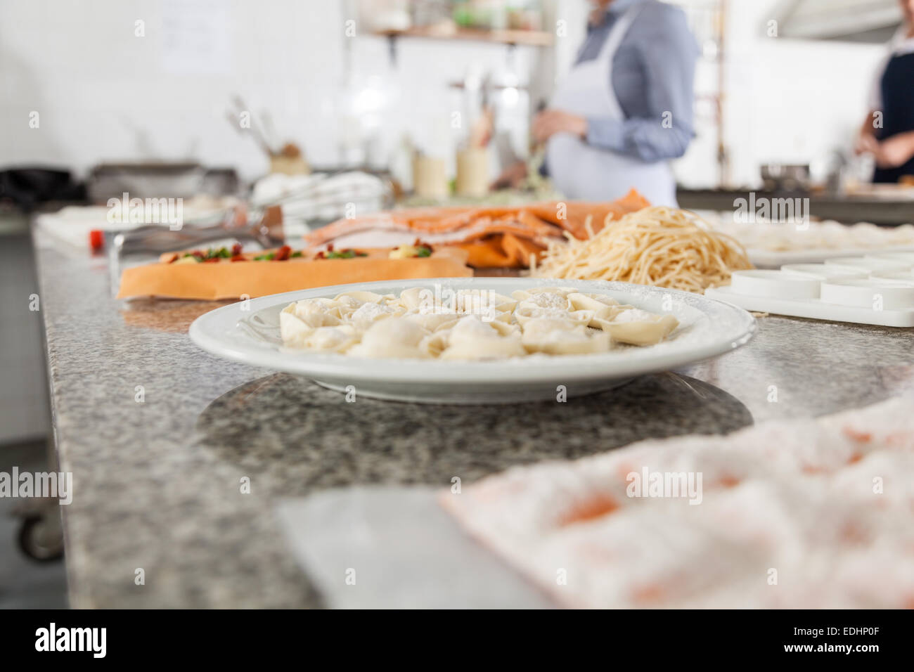 Ravioli And Spaghetti Pasta At Commercial Kitchen Counter Stock Photo ...